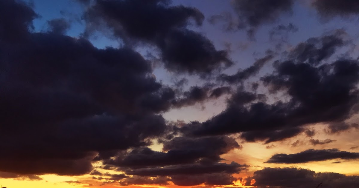 A Kiwi at the camera: Sunset looking towards the Waitakere Ranges