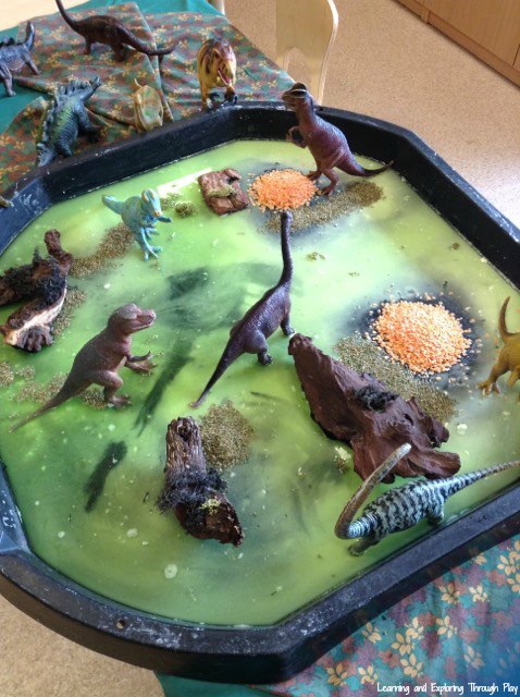 Learning and Exploring Through Play: Dinosaur Sensory Swamp Tuff Tray