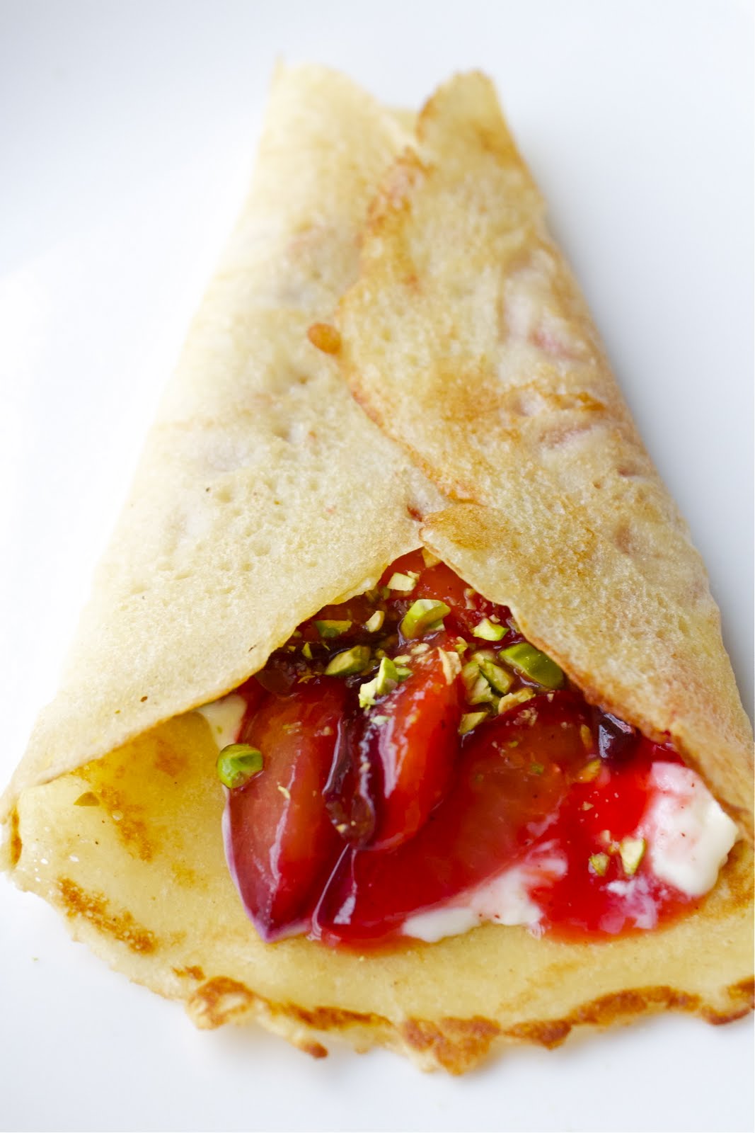 CosmoCookie: Honey Crepes with Black Plums, Mascarpone, and Pistachios