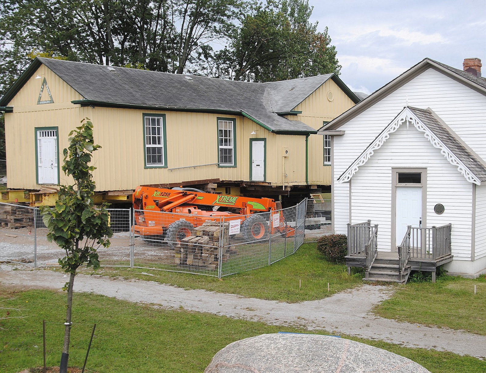 Camera on King & Aurora : Laskay Hall is mere inches from new setting...