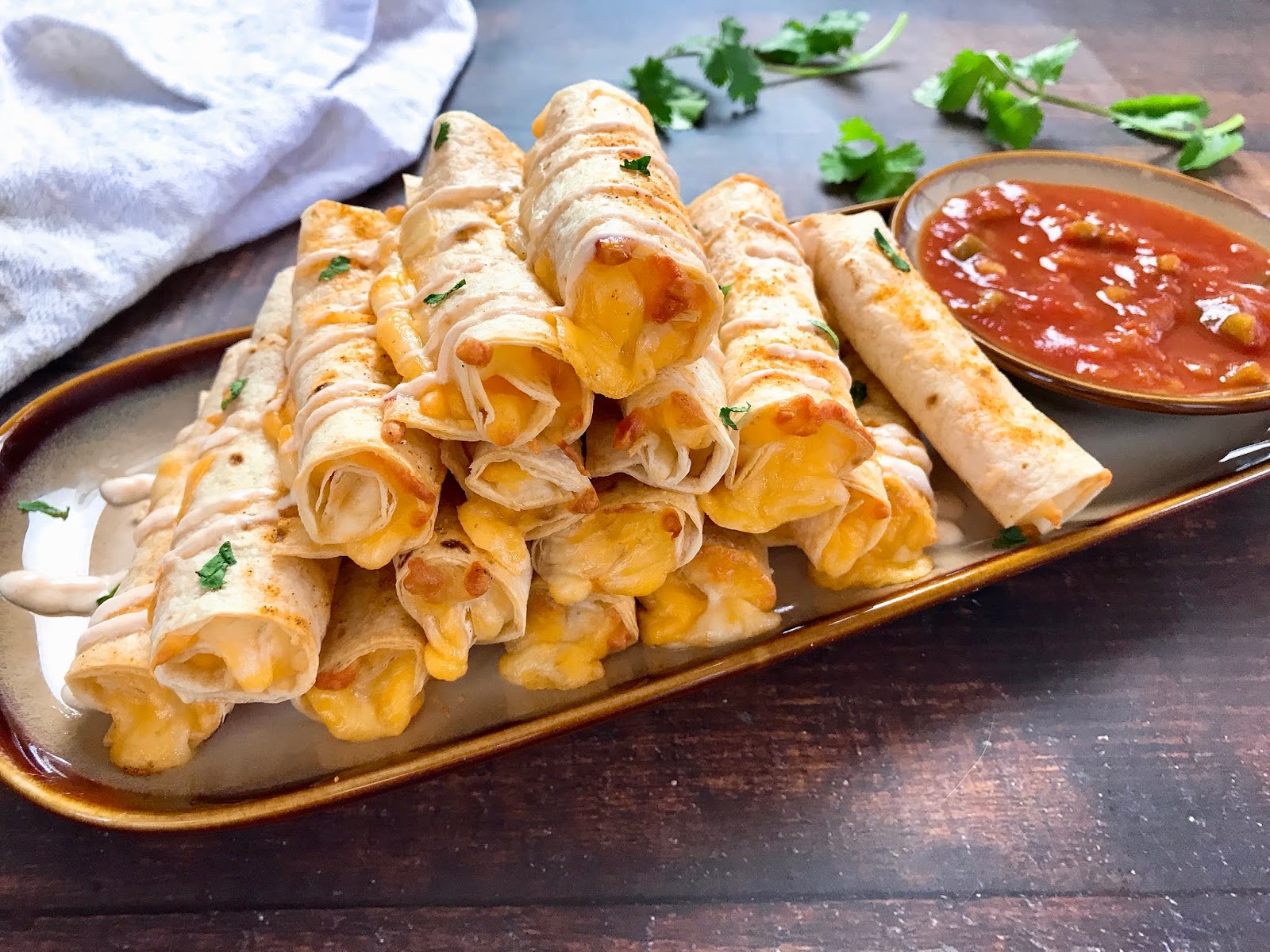 Baked Cheese Taquitos with Spicy Sour Cream