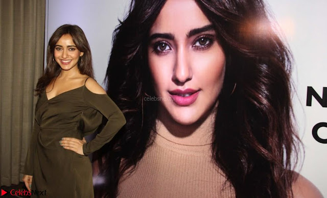 Neha Sharma cute and enchanting smile in a deep neck green gown at ...