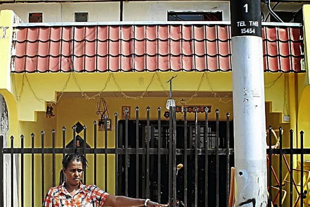 Year One Malaysia: TNB pole in front of her house!