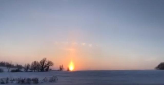 This is just a natural sky phenomenon? Sun pillar with triangular ...
