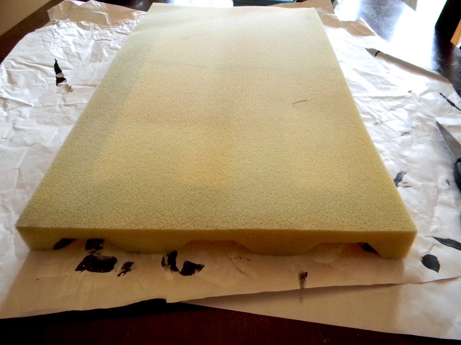 Now, while that's drying, take a large piece of foam. This stuff has ...