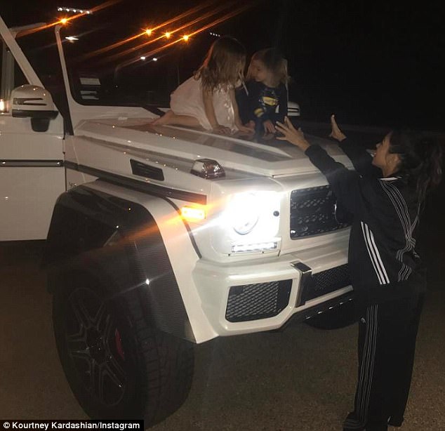Penelope and Reign check out their dad, Scott Disick's new car (photos)