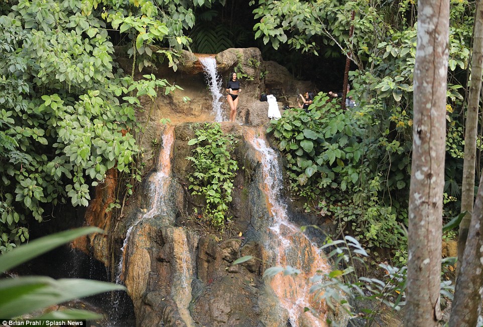 Kim K takes a dip in a waterfall while wearing sexy black bikini (photos)