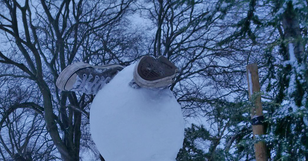 Edinburgh and Us: Ta-da! Snowman Larry performs a headstand at Leith Links