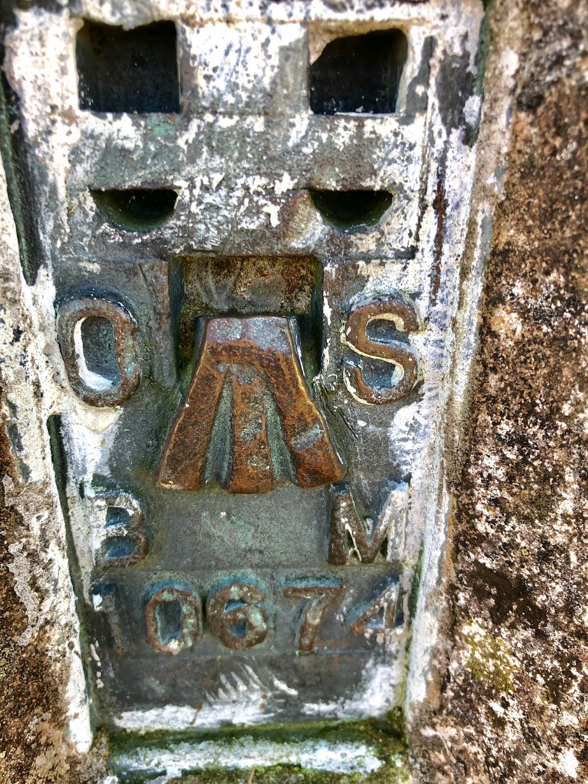 Great Asby limestone pavement, cairns and an OS trig point at the Knott ...