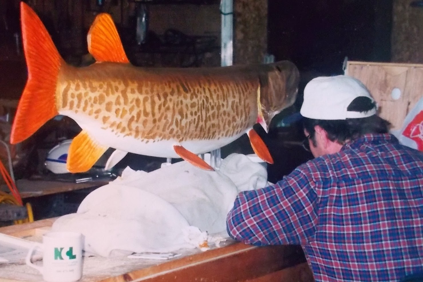 CHARLES WEISS ART: Repainting a wood carved Muskie at Vermilion Bay ...