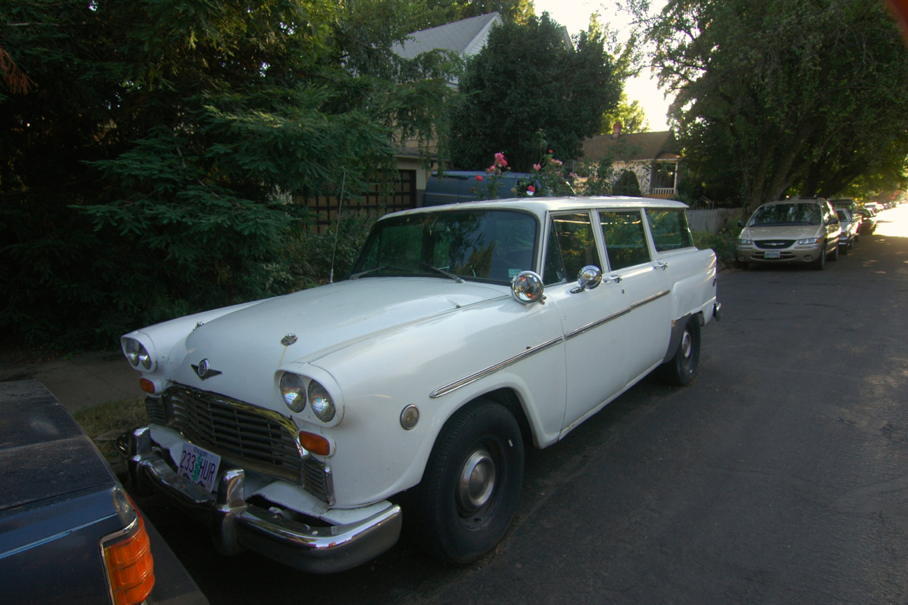 OLD PARKED CARS.: 1971 Checker Marathon Wagon.