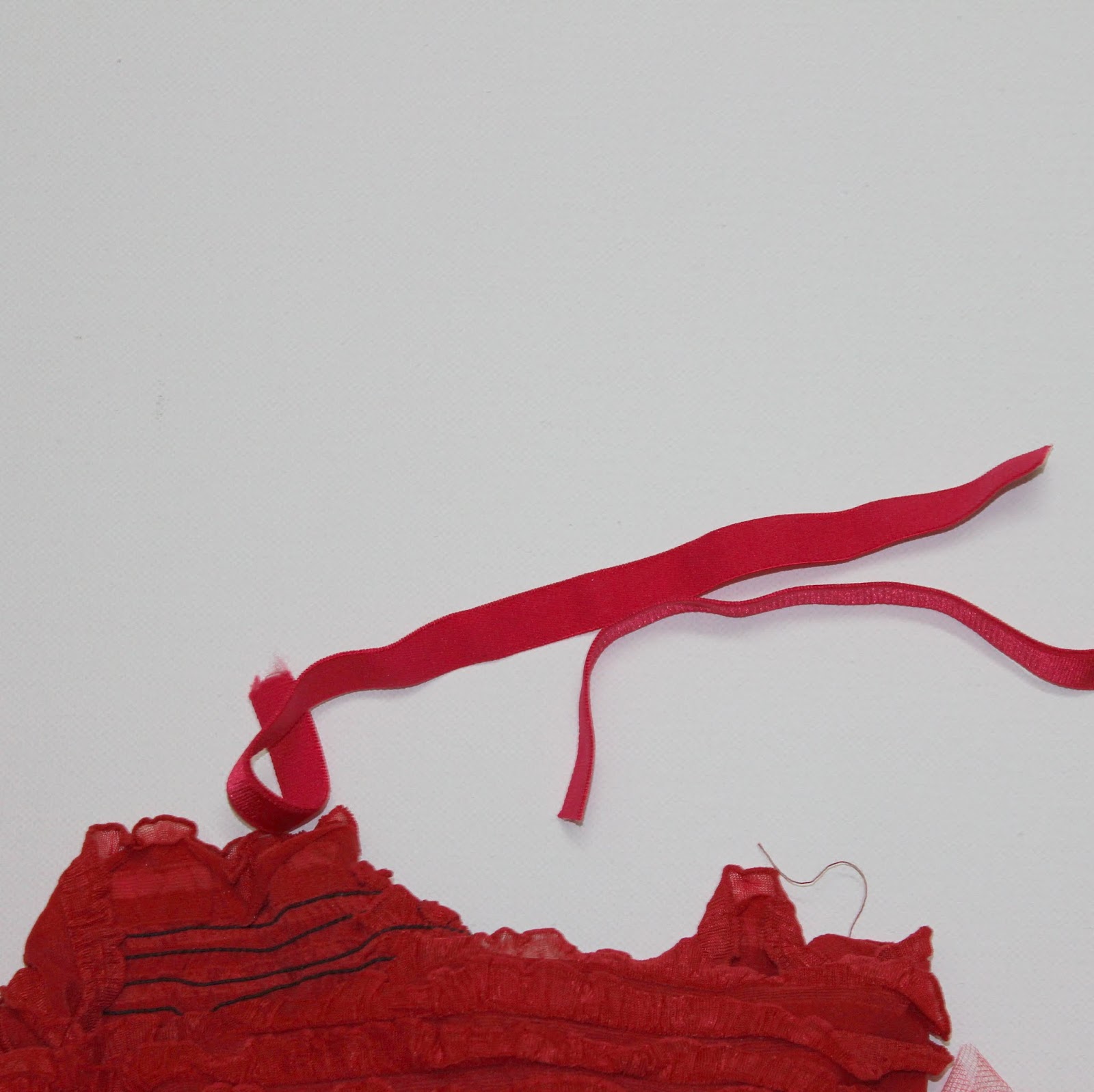 Cut two pieces of red elastic - 12 inches long each