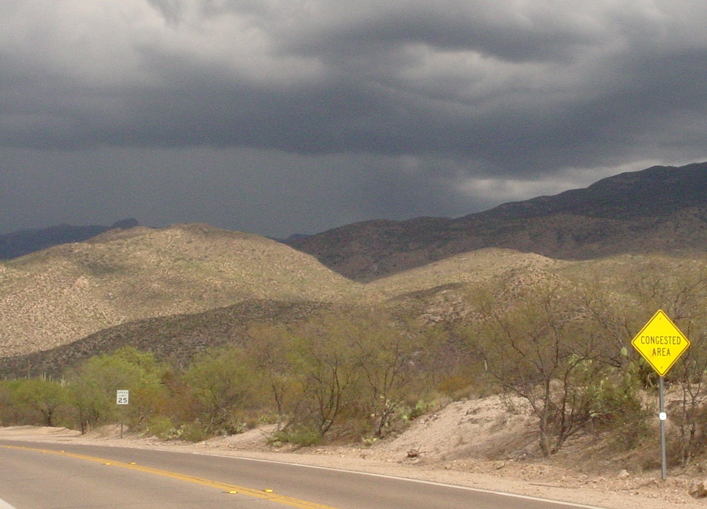 Tucson Daily Photo ~: Stormy weather and a funny warning sign