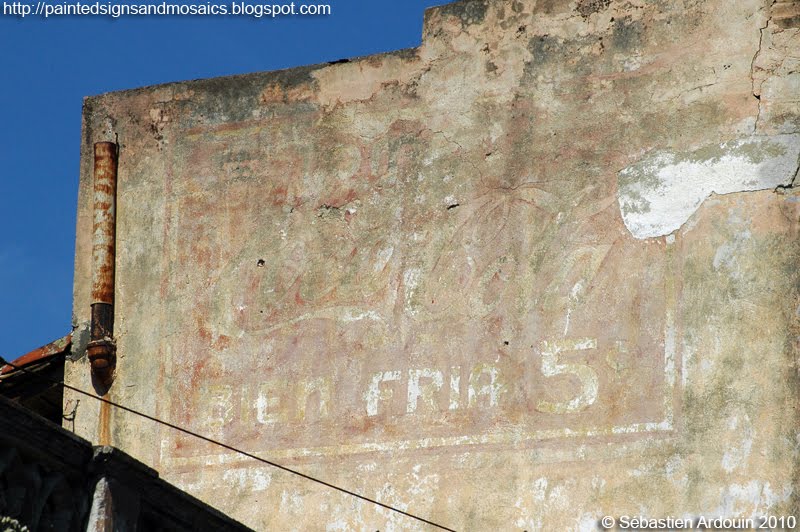 Painted signs and mosaics: Coca Cola, Santa Clara, Cuba