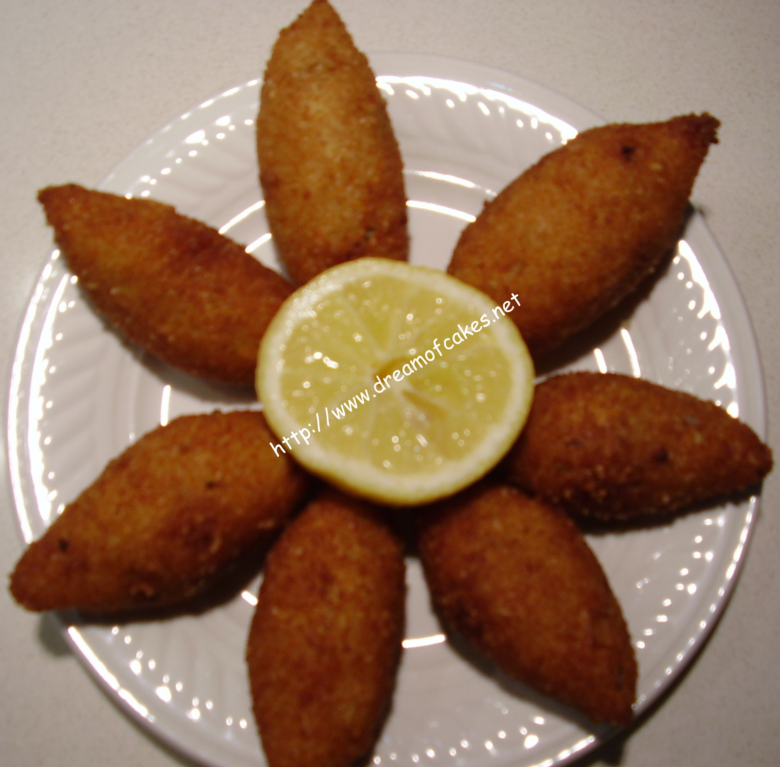 Koupes (Wheat bulgur filled with ground pork meat)