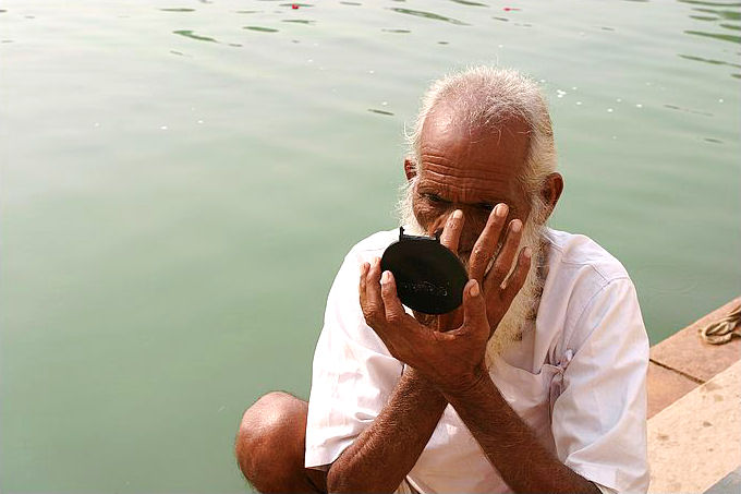 The Tilak - Tilaka sacred symbol on forehead or between eyebrows