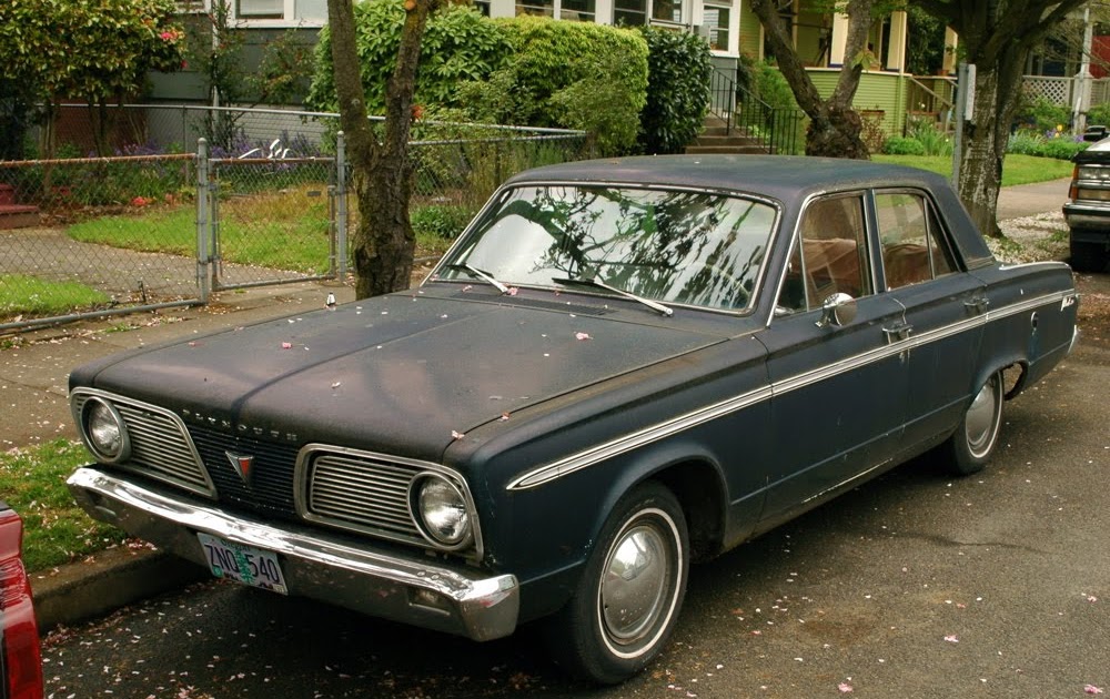 OLD PARKED CARS.: 1966 Plymouth Valiant 200 Sedan.