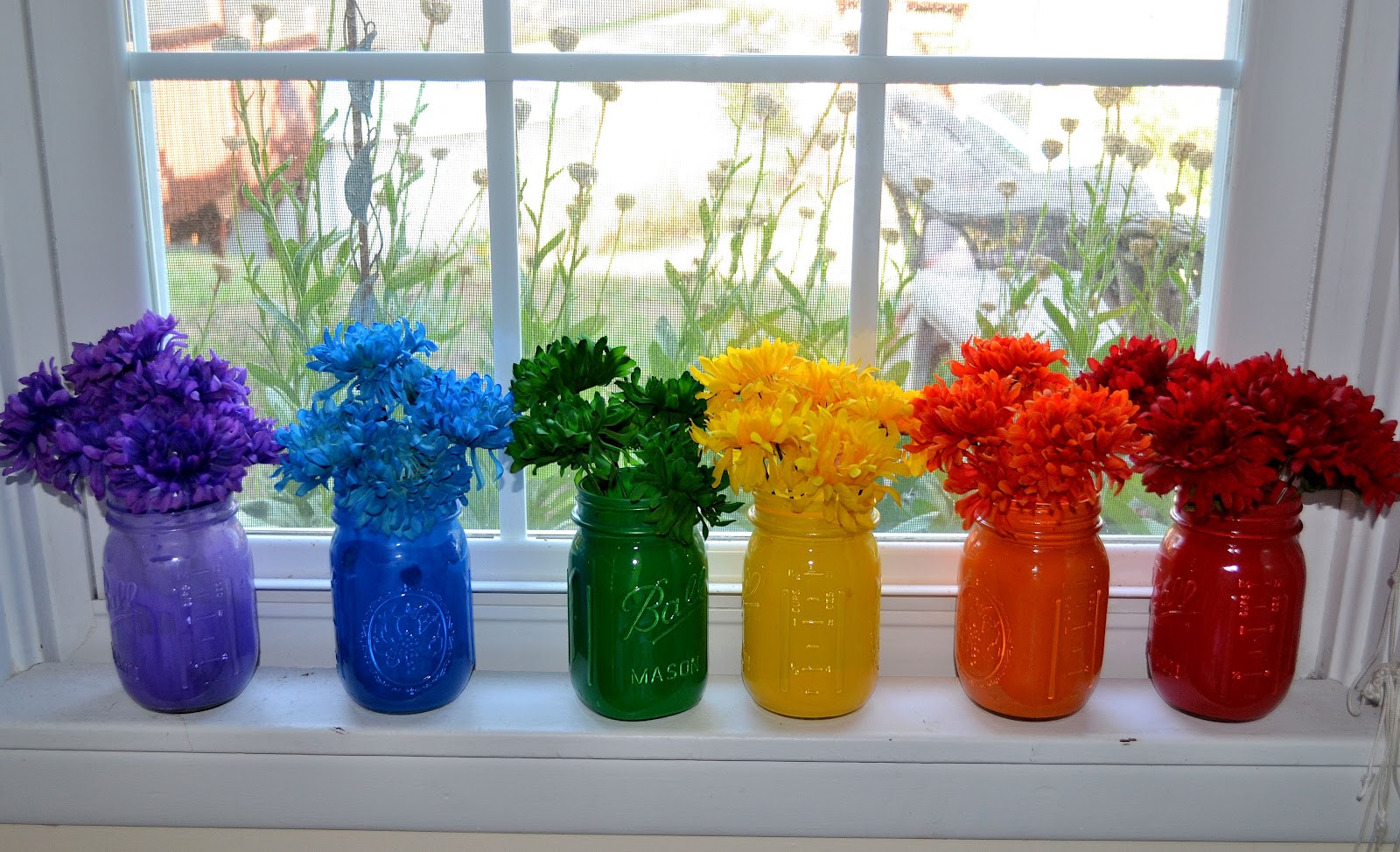 From The Hive: colored flowers in colored jars