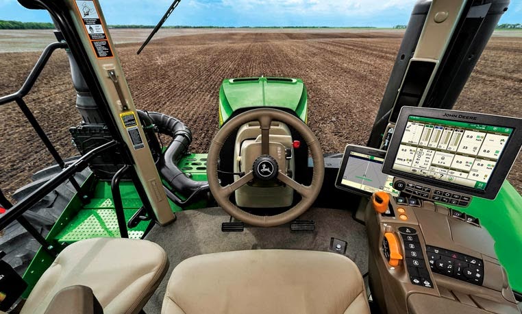A John Deere cab is a high tech place to work.