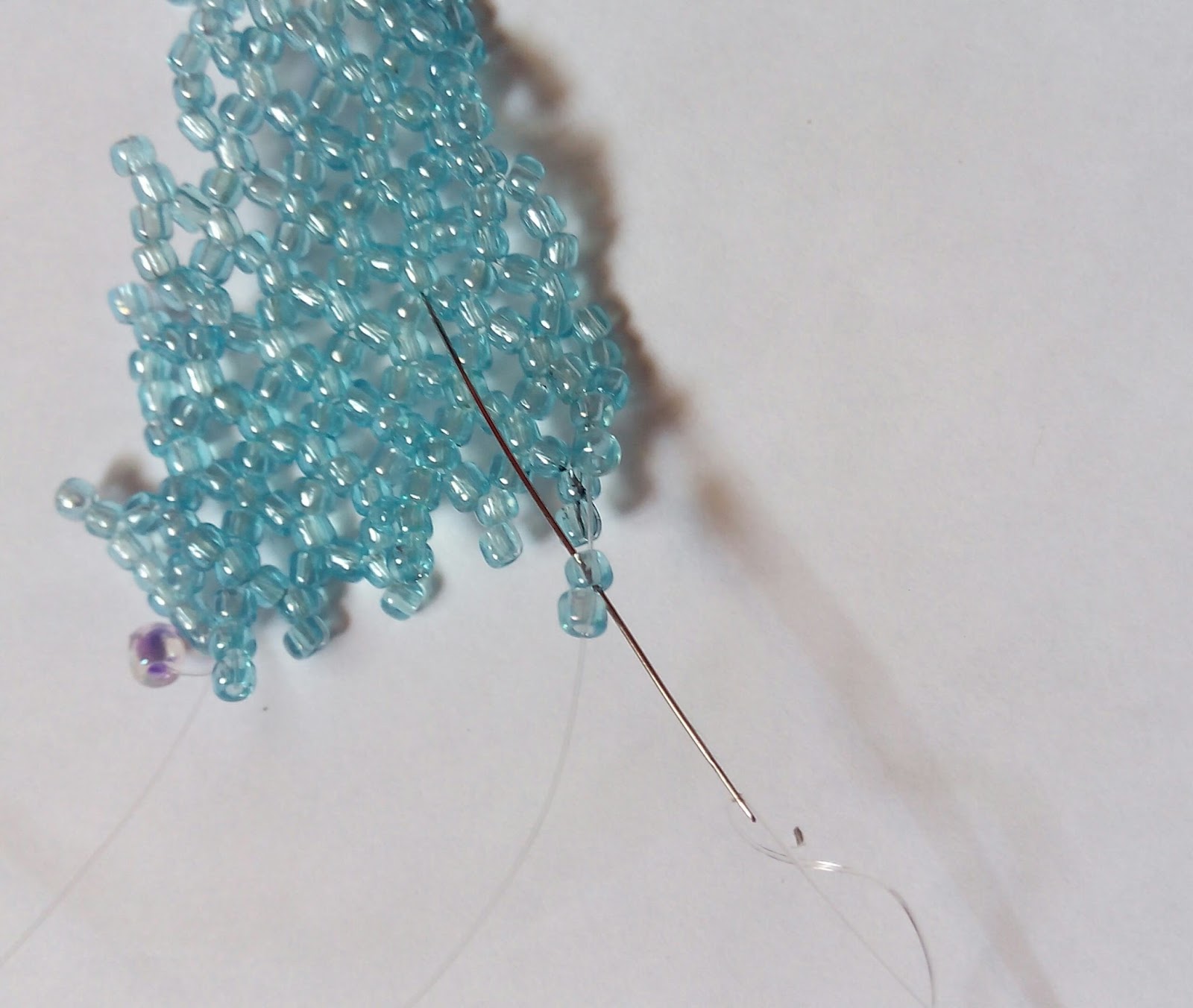 Beadination: Beautiful beaded flower using the bead netting technique.