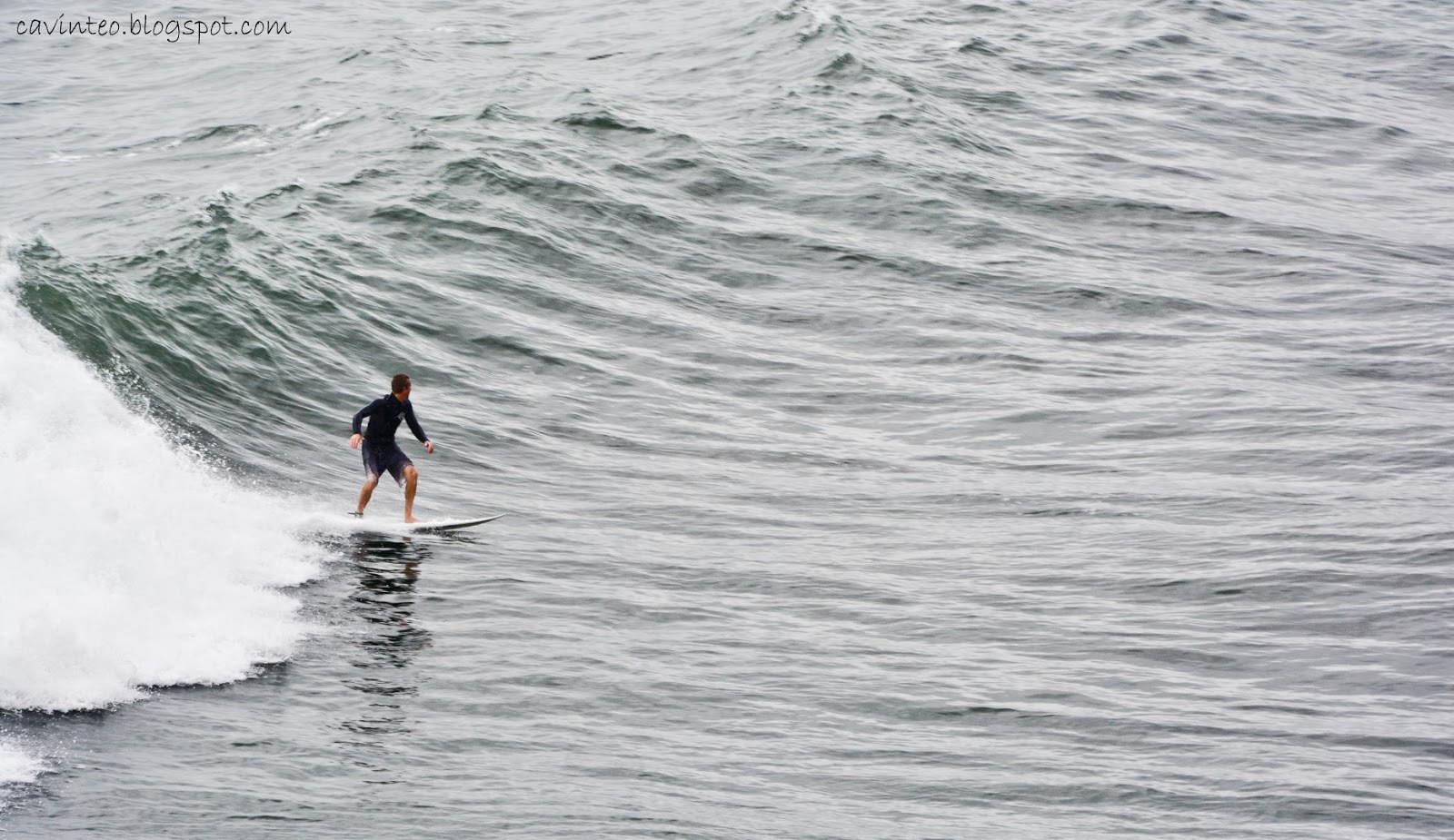 Entree Kibbles: Surfers Surfing on Choppy Waters at Tanah Lot in Bali ...