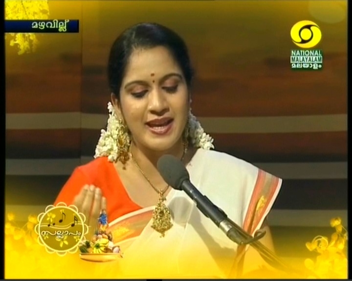 playback singer akhila anand in set saree cute images