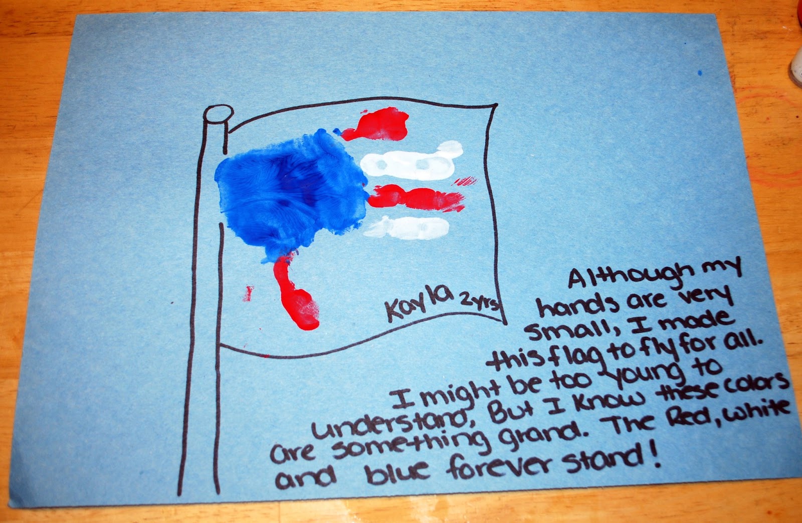 Sprinkled with Blessings from Above: Handprint flag and poem