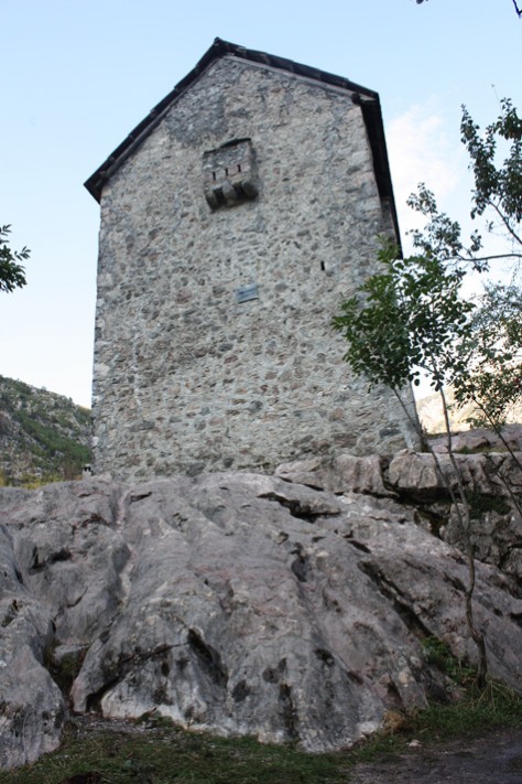 The towers of Theth are visited by tourists.