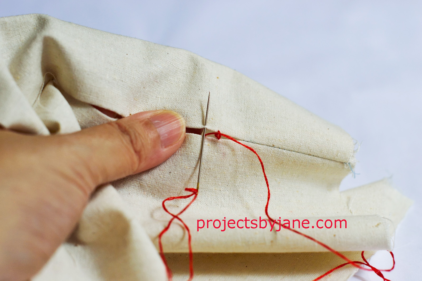 How to hand sew gap in fabric - projectsbyjane.com