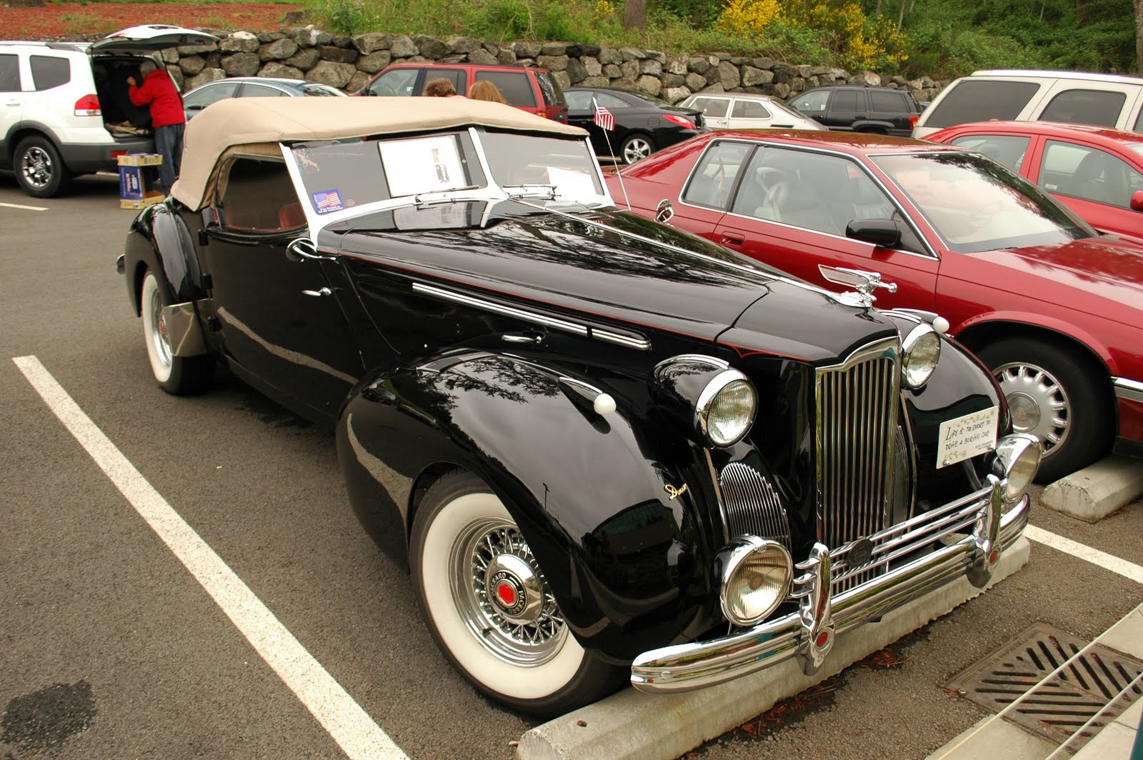 OLD PARKED CARS.: 1938 Darrin Packard Convertible Victoria.