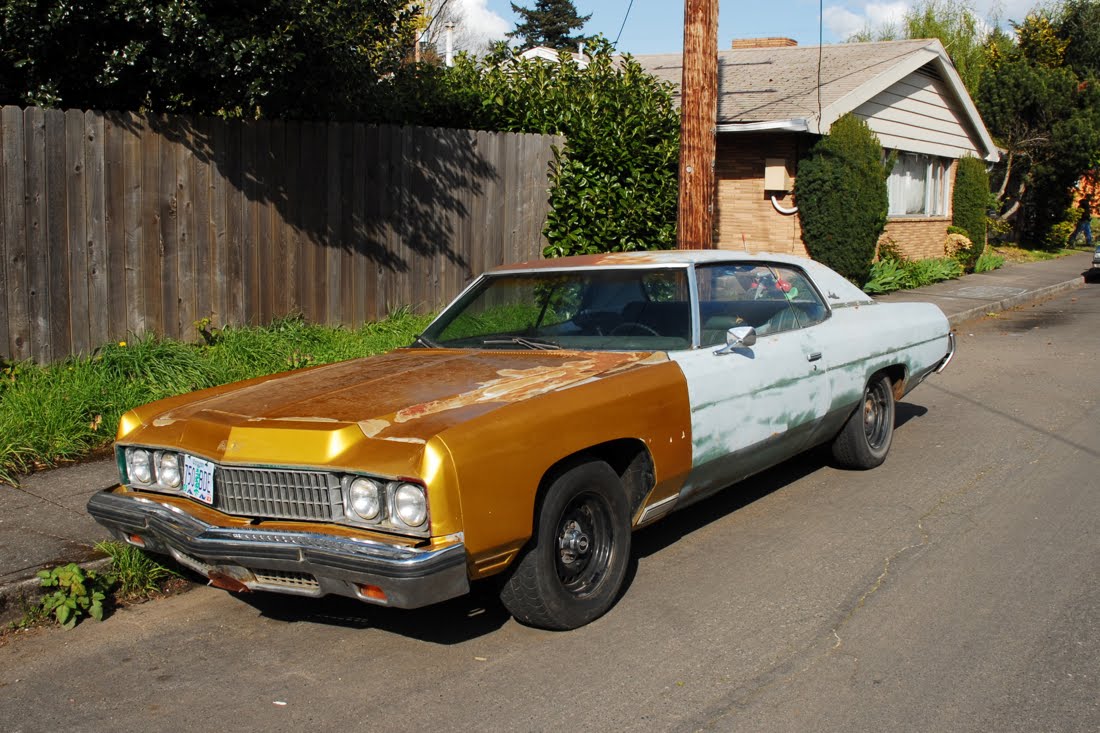 OLD PARKED CARS.: 1973 Chevy Impala Custom.