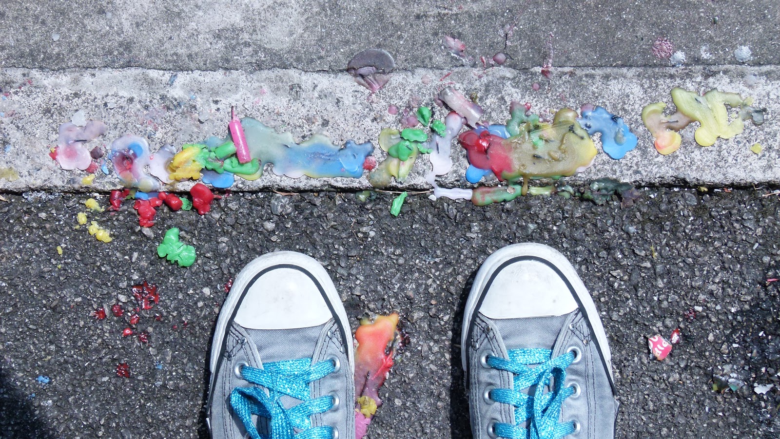 Sneakers and melted crayons on the ground free picture for commercial user