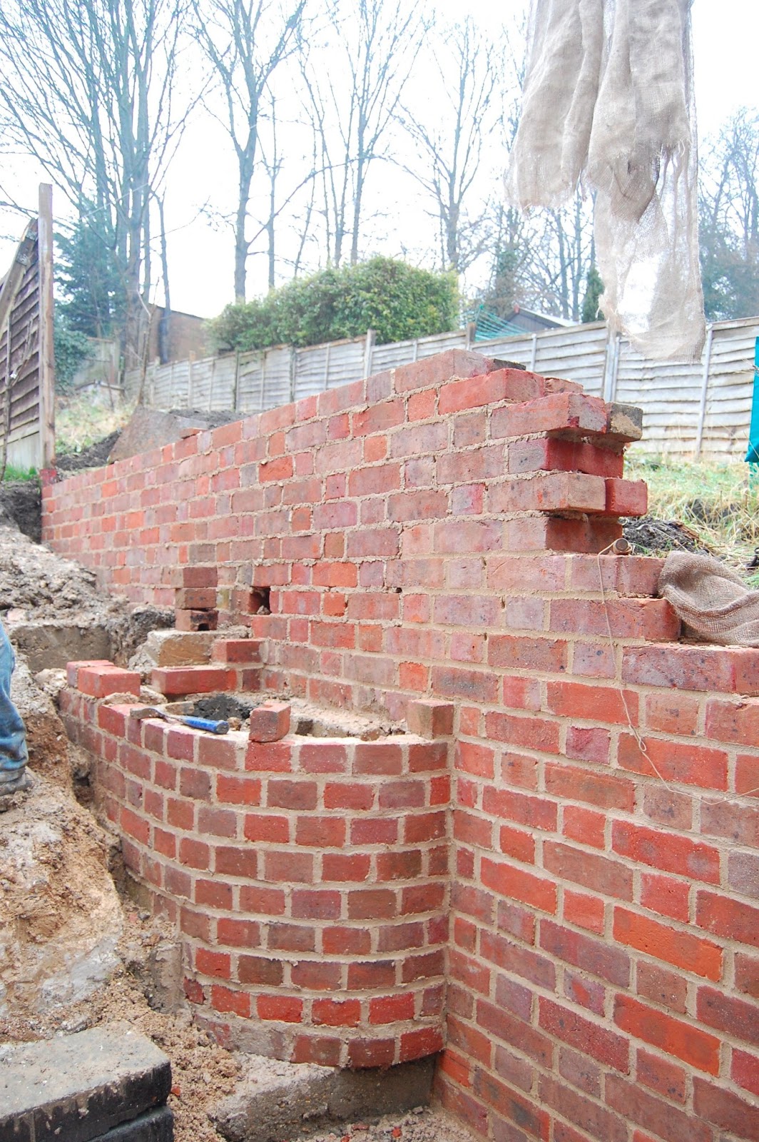 Higher brick piers and curved brick planters