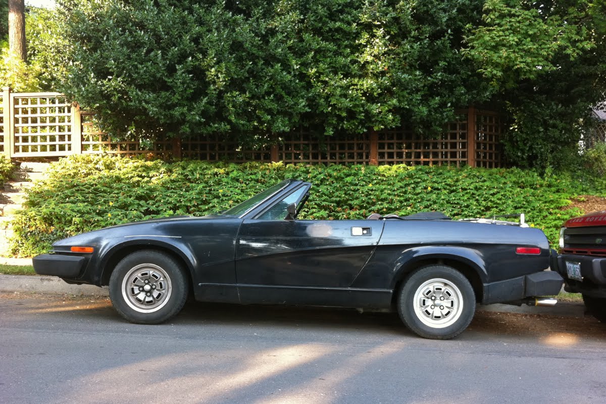 OLD PARKED CARS.: 1980 Triumph TR7 Spider.