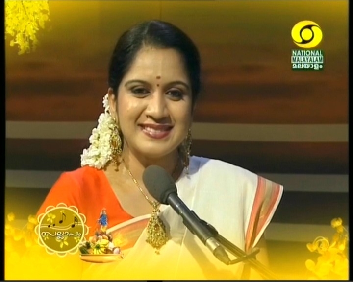 playback singer akhila anand in set saree cute images