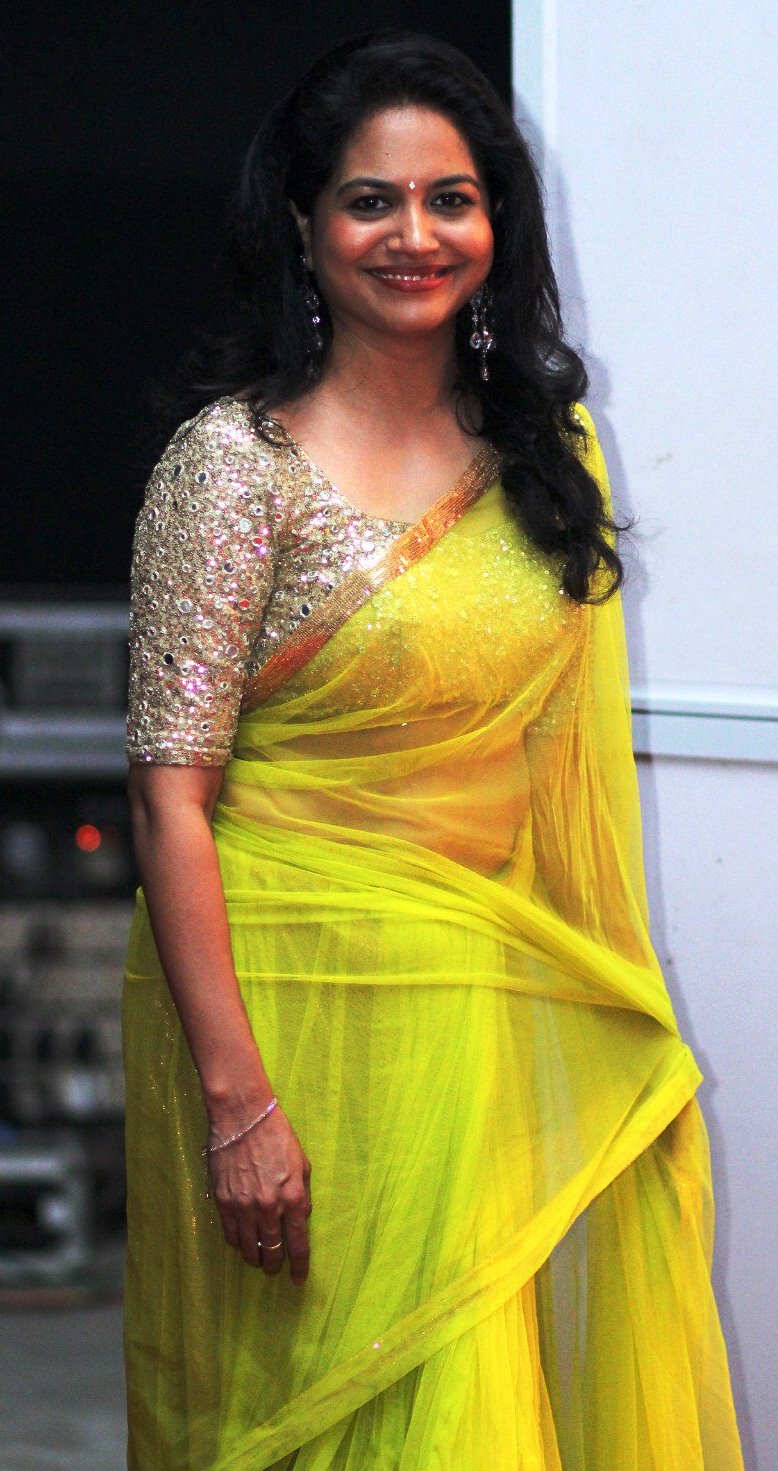 Tollywood Singer Sunitha Stills In Transparent Yellow Saree and Golden ...