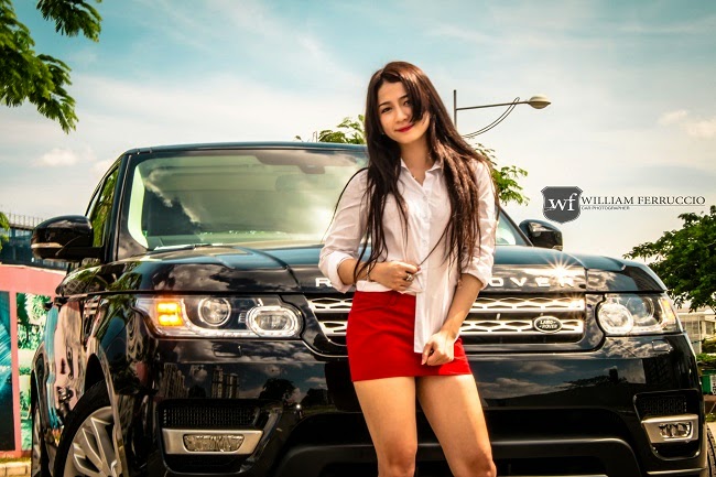 Rebellion office girl poses with Range Rover Sport | Carsfresh