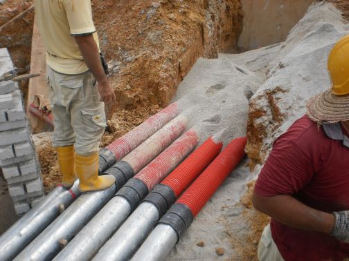 Electrical Installations: Cable duct crossing roadside drain