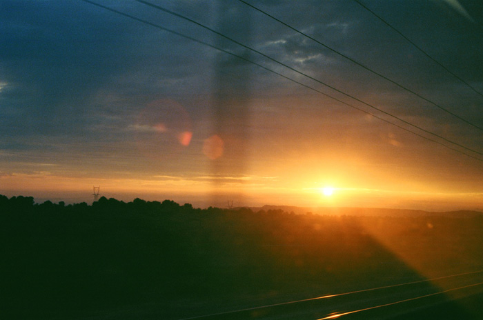On My Way: Sunset through a train window