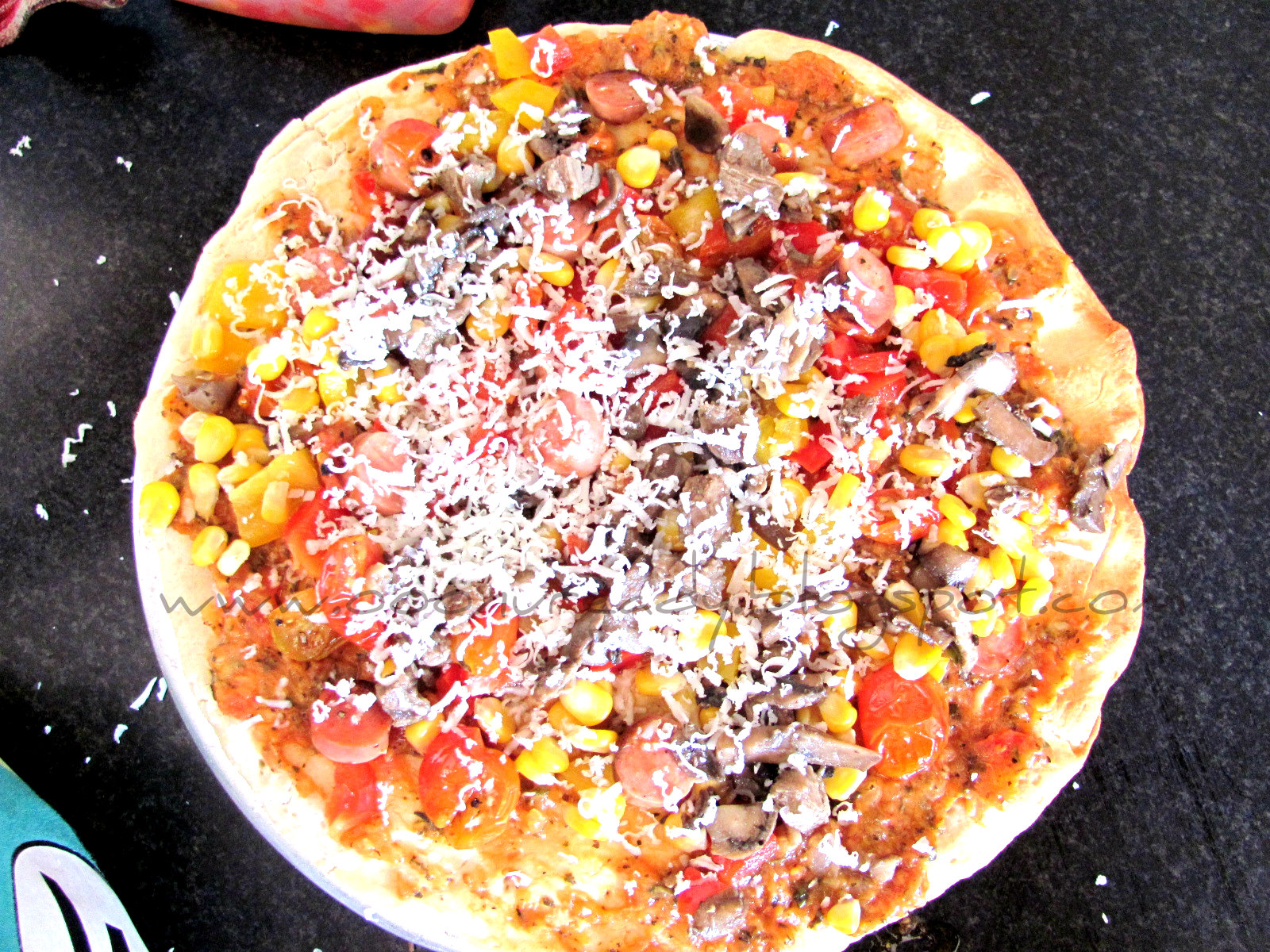 Oonu ready: Mutton Pizza with Corn, Cherry Tomatoes and Sausages