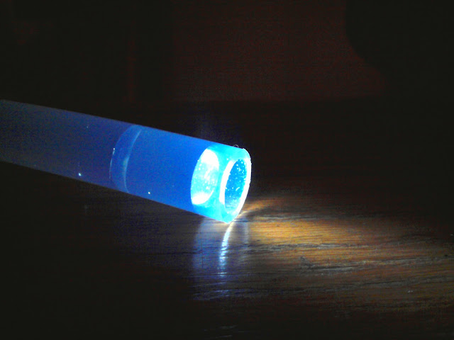 (+ 1 1): Transmitting light, via liquid, down a plastic tube