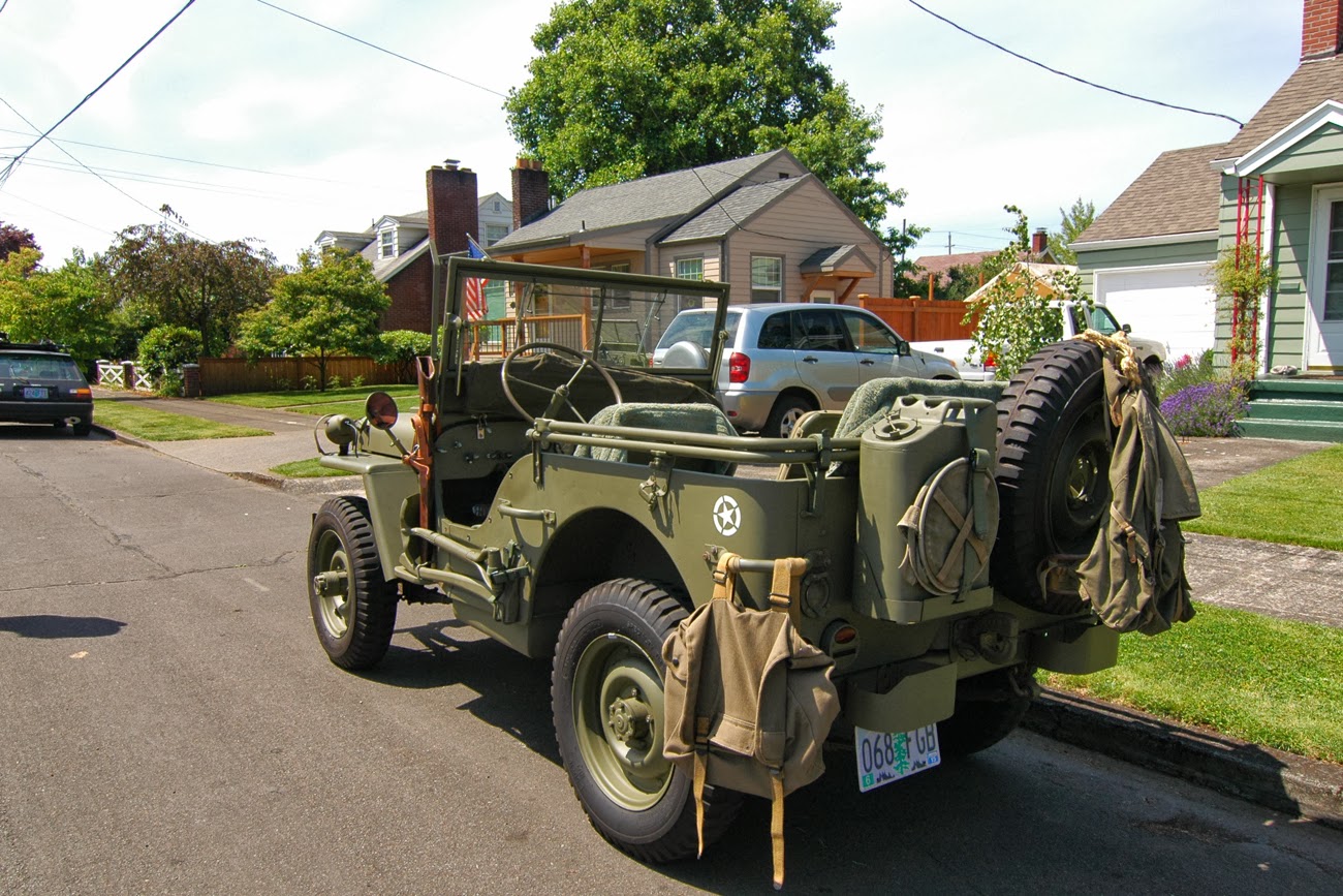 OLD PARKED CARS.: Three Jeeps Deep: 1942 Ford GPW.