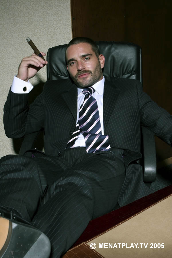 Edu Boxer relaxes with a cigar after a stressful meeting. | Black suit ...