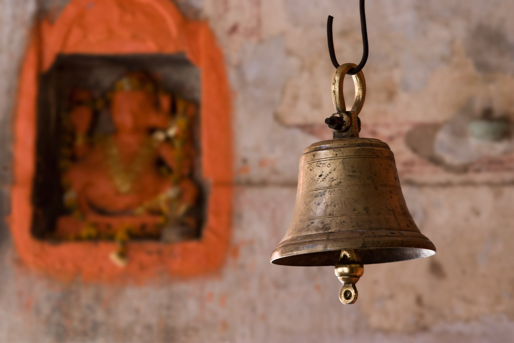 While giving aarti to god, why will we ring bell?