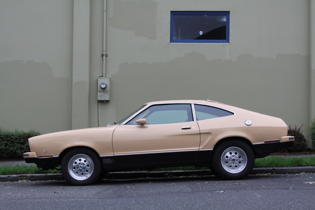 OLD PARKED CARS.: 1977 Ford Mustang II Mach I on the Malaise Mile.