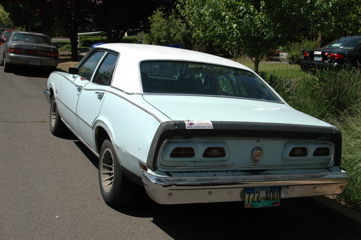 OLD PARKED CARS.: 1974 Mercury Comet.