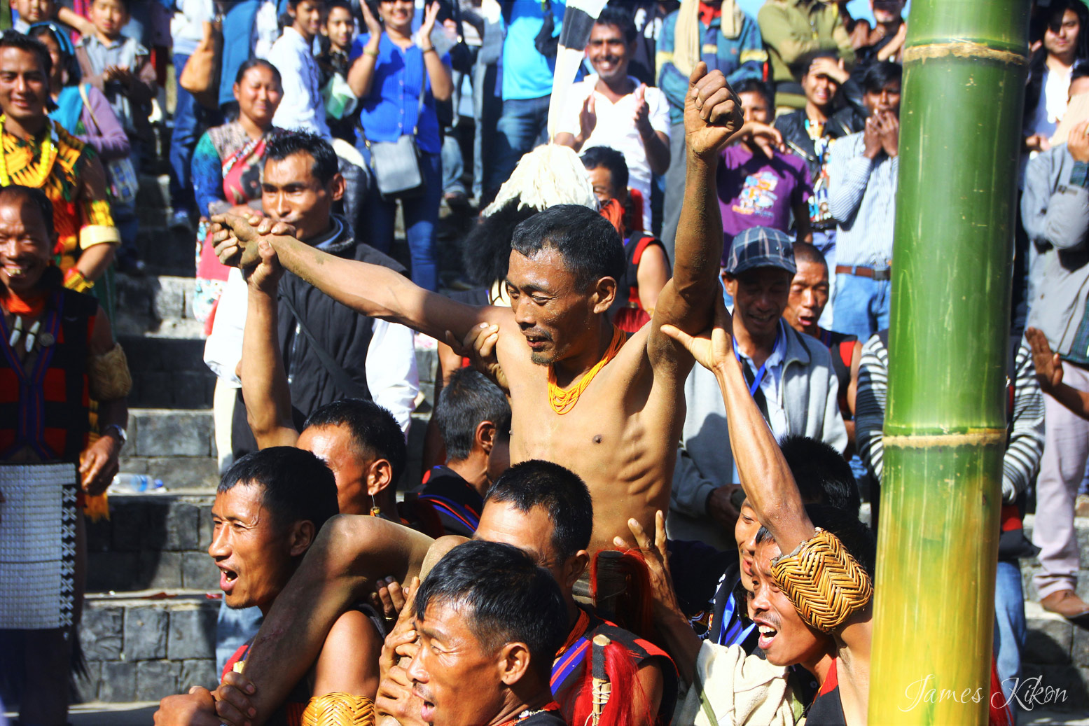 Bamboo pole climbing competition at the Nagaland Hornbill Festival 2015