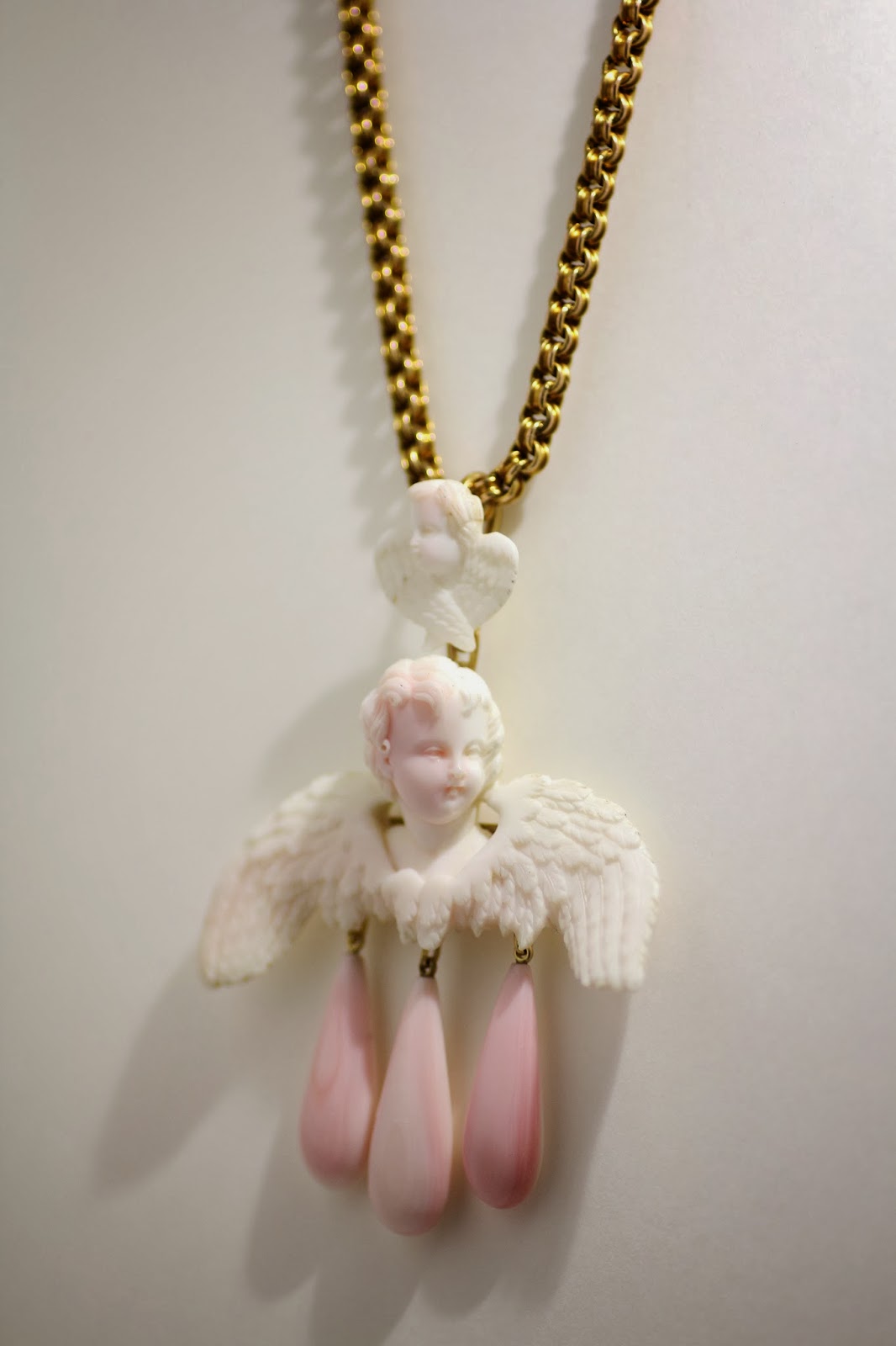 Bright days ahead: Queen conch shell Angel cameo pendant circa 1860