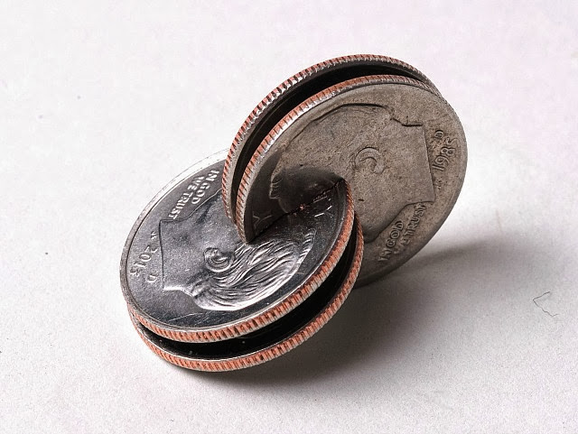 Complex Geometric Forms Made from Coins Notched and Joined Together ...