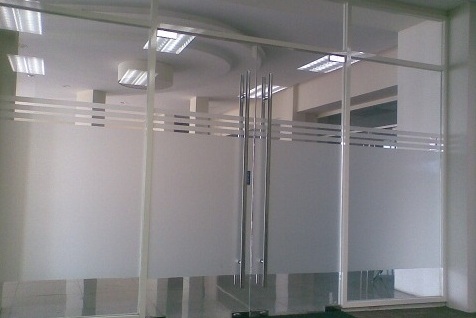 Sand blasted glass partition for conference room